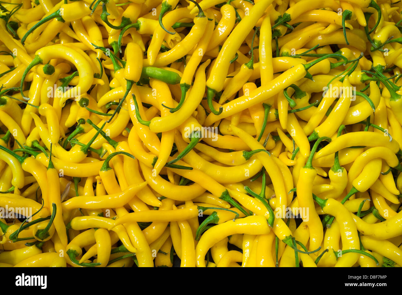 Full frame take of raw hot yellow peppers Stock Photo - Alamy