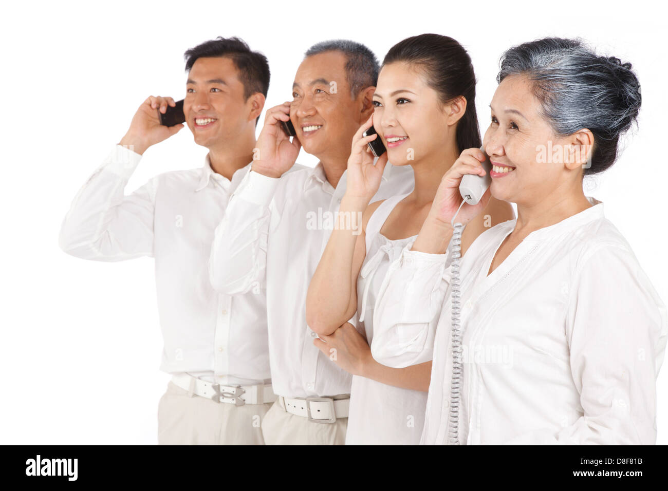 Old couple and young couple making phone call Stock Photo - Alamy
