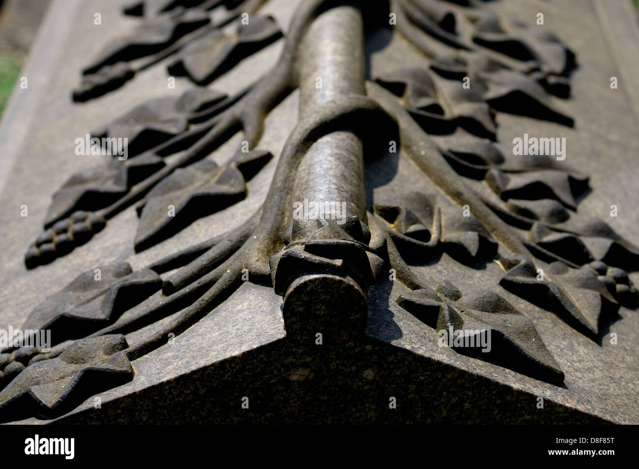 Carving on top of a grave Stock Photo - Alamy