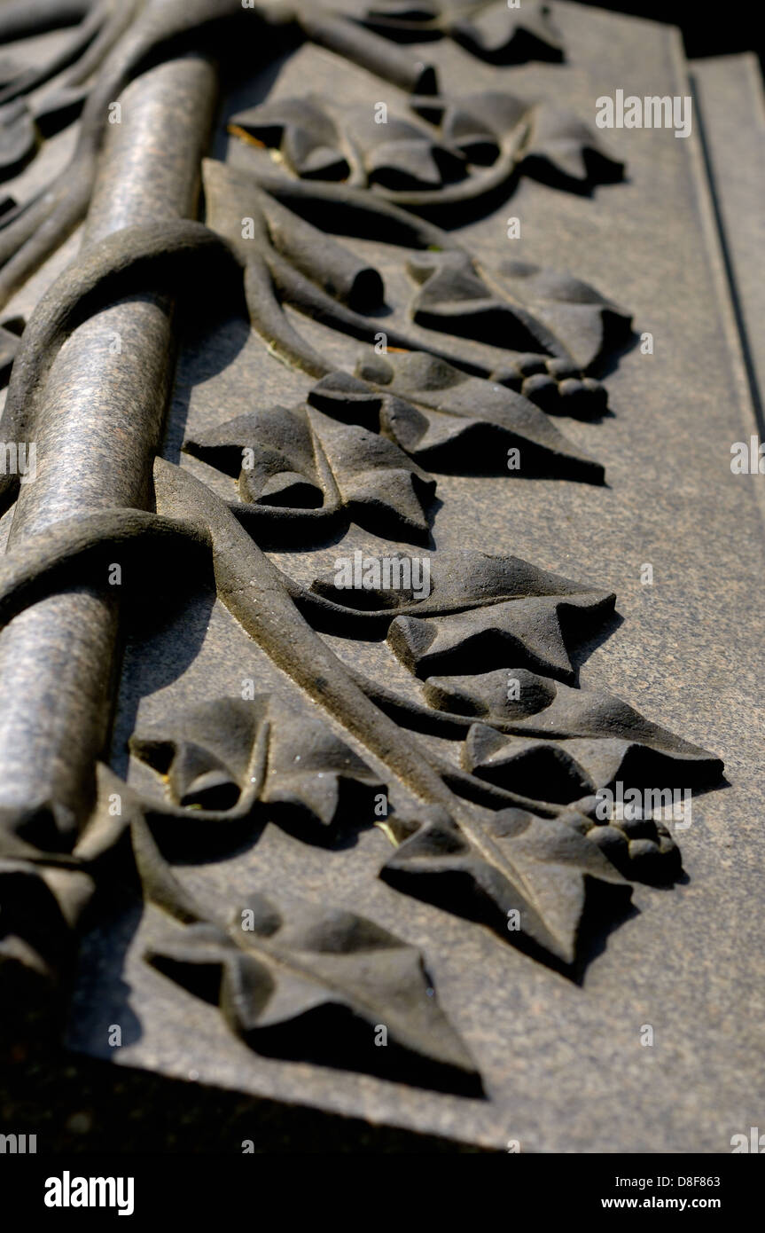 Carving on top of a grave Stock Photo - Alamy