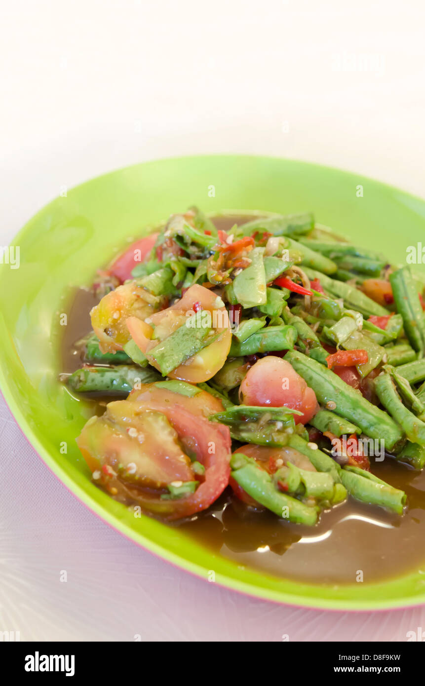 spicy cowpea salad on green dish , asian cuisine Stock Photo - Alamy