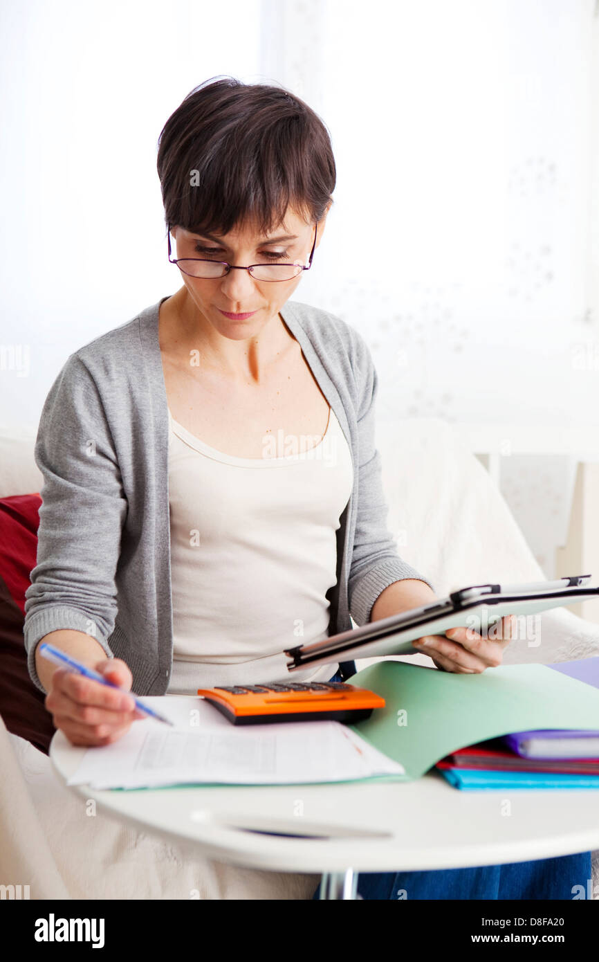 WOMAN DOING PAPERWORK Stock Photo - Alamy