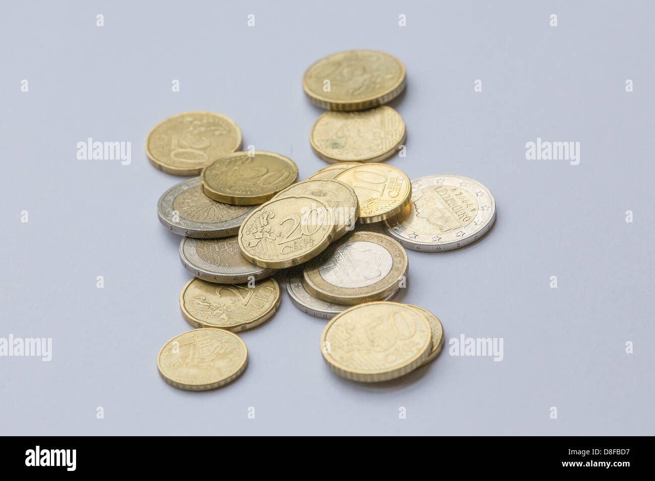 Spare change. Pile of Euro coins with a 20 cents coin clearly visable ...