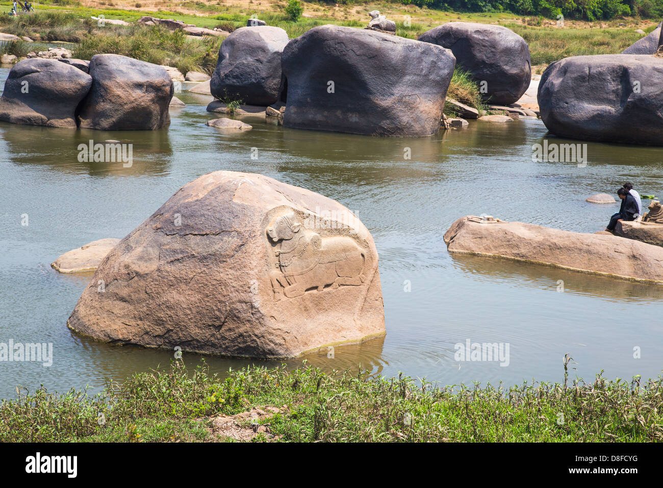 Carving of Nandi on a rock in the river, Hampi, India Stock Photo - Alamy