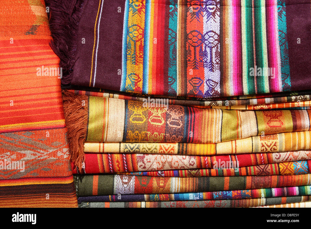 Handmade linens for sale at the outdoor craft market in Otavalo ...