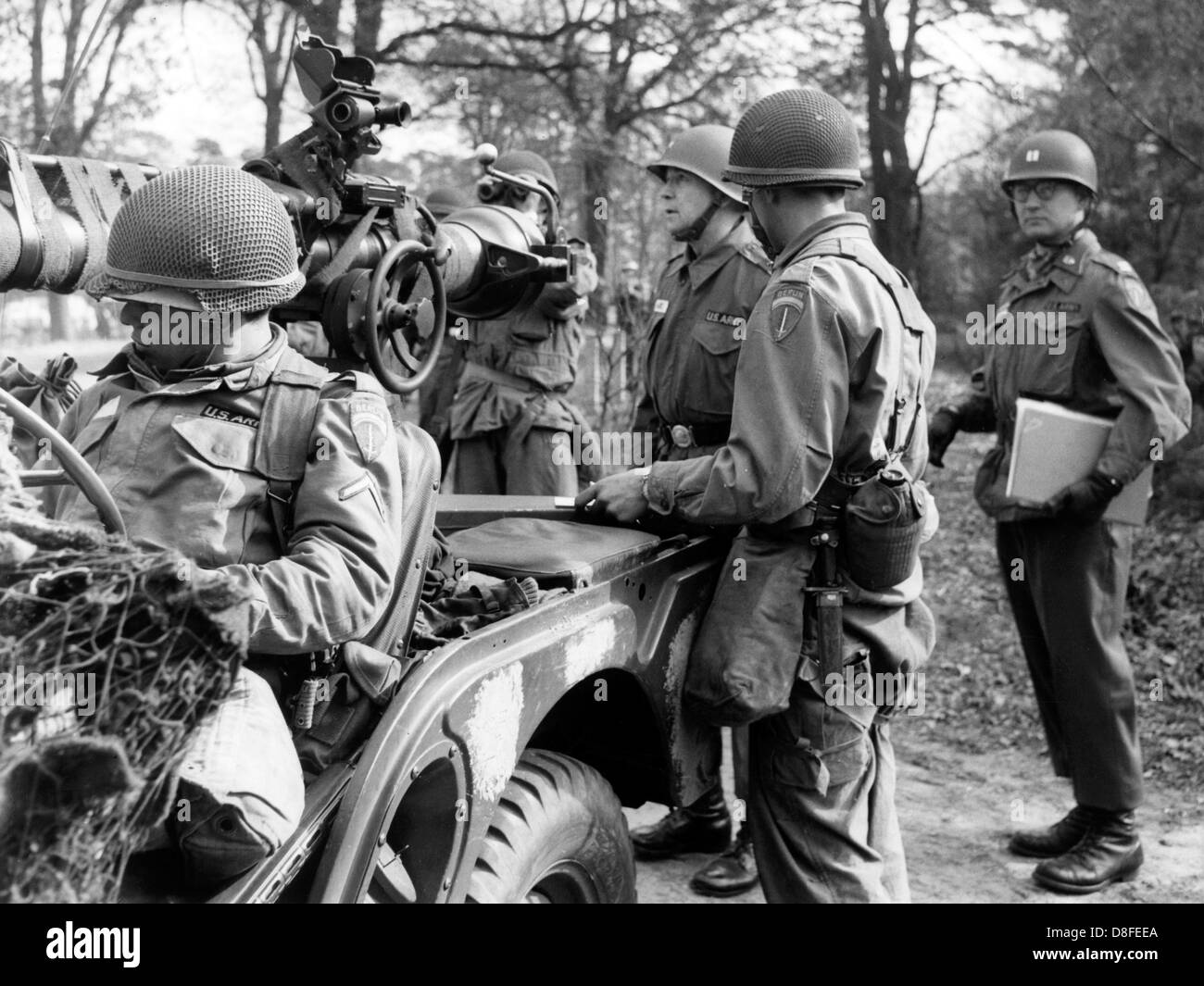 US general Frederick O. Hartel (m) inspects a jeep during an exercise ...