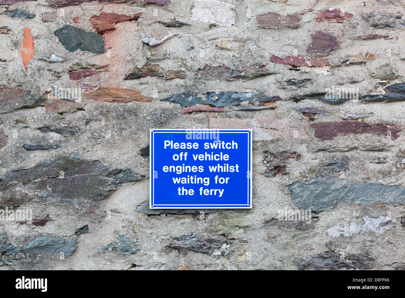 Sign on a wall requesting car drivers to switch off their engines Stock ...