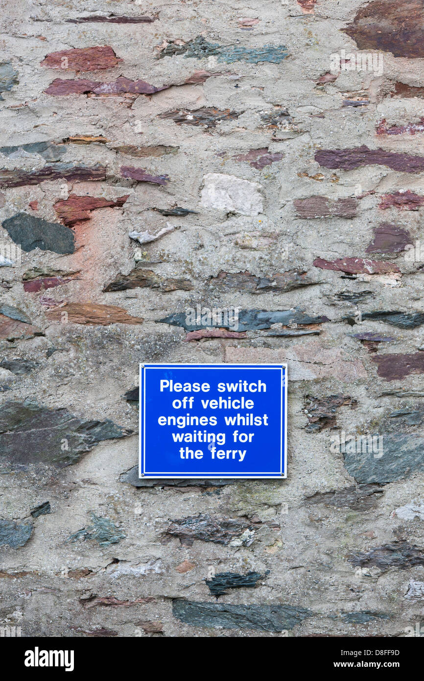 Sign on a wall requesting car drivers to switch off their engines Stock ...