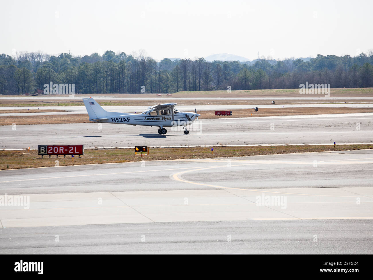 American Flyers prop plane taxiing on a runway Stock Photo - Alamy