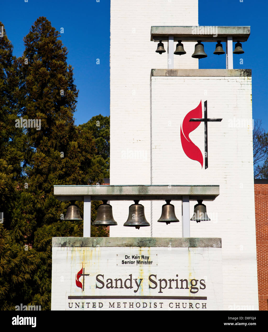 Bells on white brick sign at Methodist church Stock Photo - Alamy