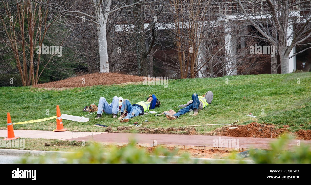 Three construction workers taking a mid-day break Stock Photo - Alamy