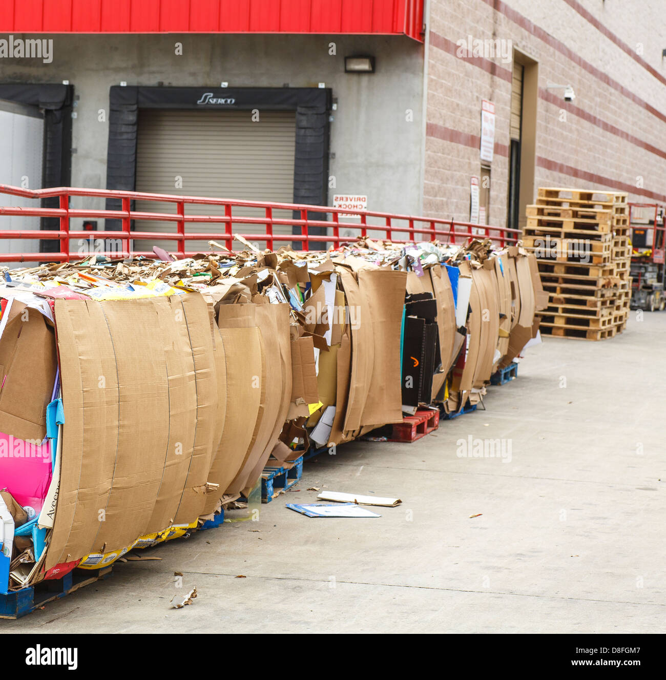 Colorful cardboard bundled for recycling Stock Photo - Alamy