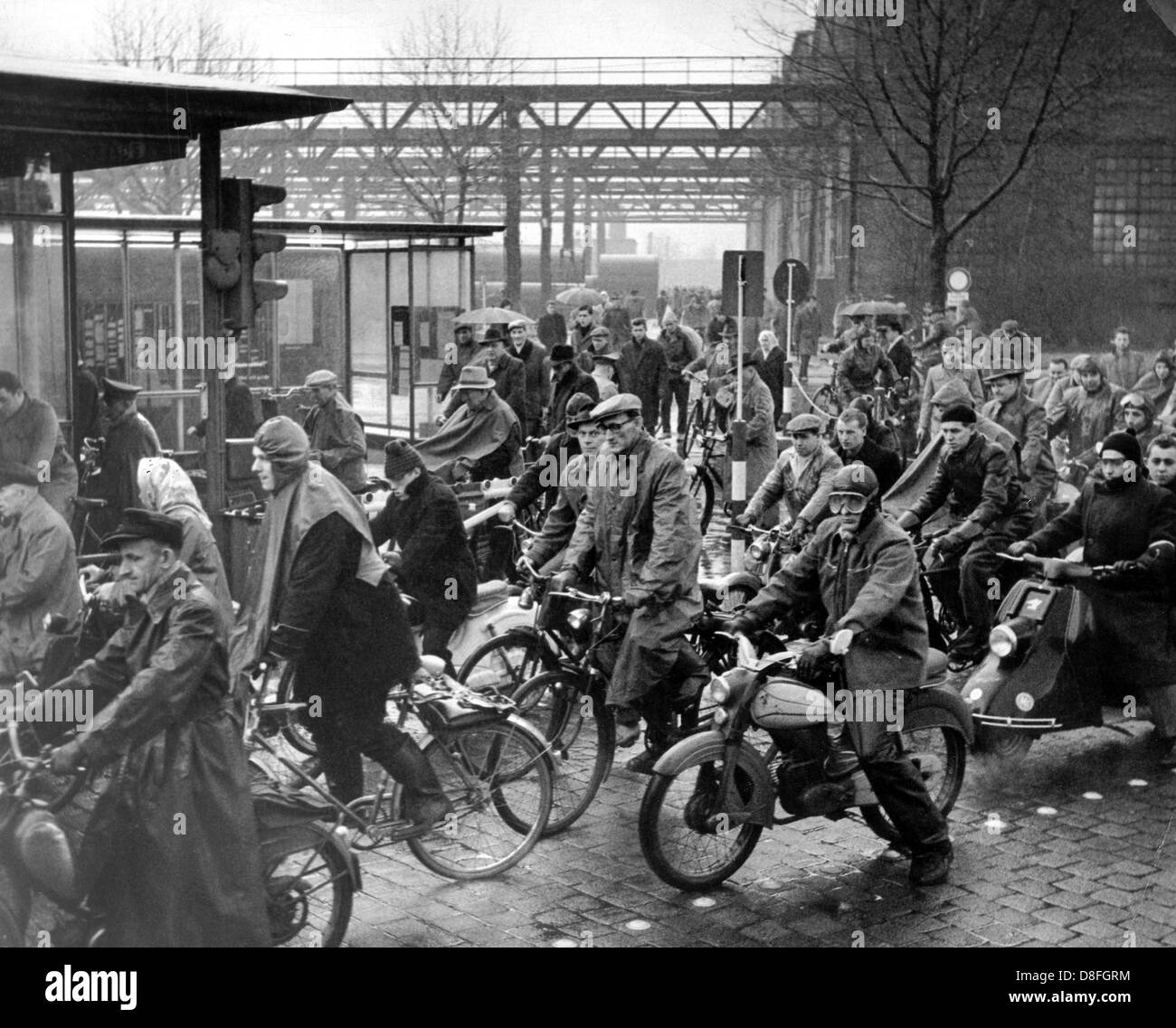 Workers leaving the factory grounds after their shift in the 1960s ...