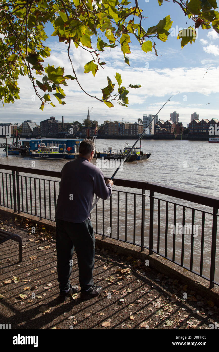 Man eel fishing in River Thames, London Stock Photo - Alamy