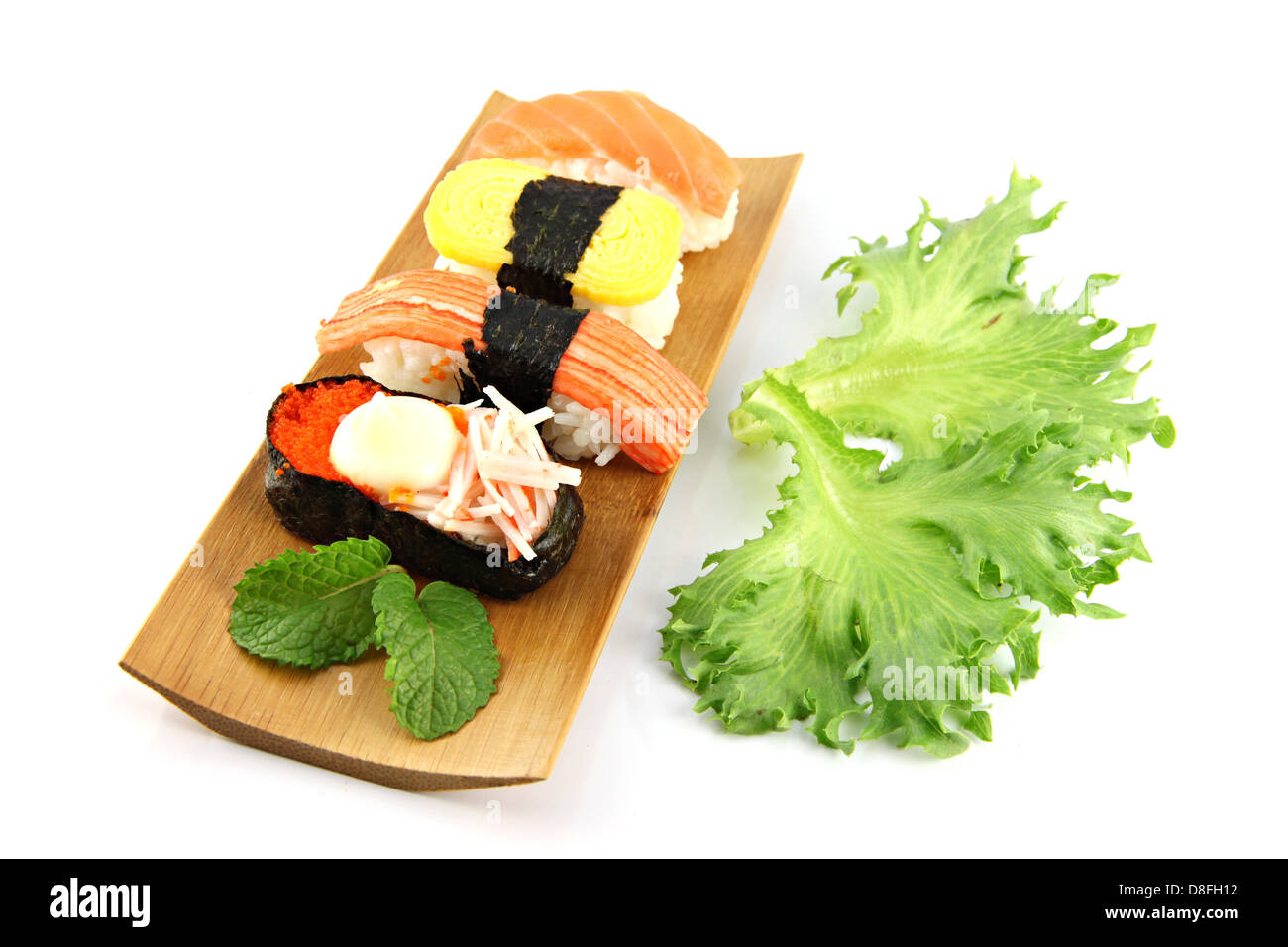 Sushi made from seafood and a vegetables on the side,Sushi is a food of ...