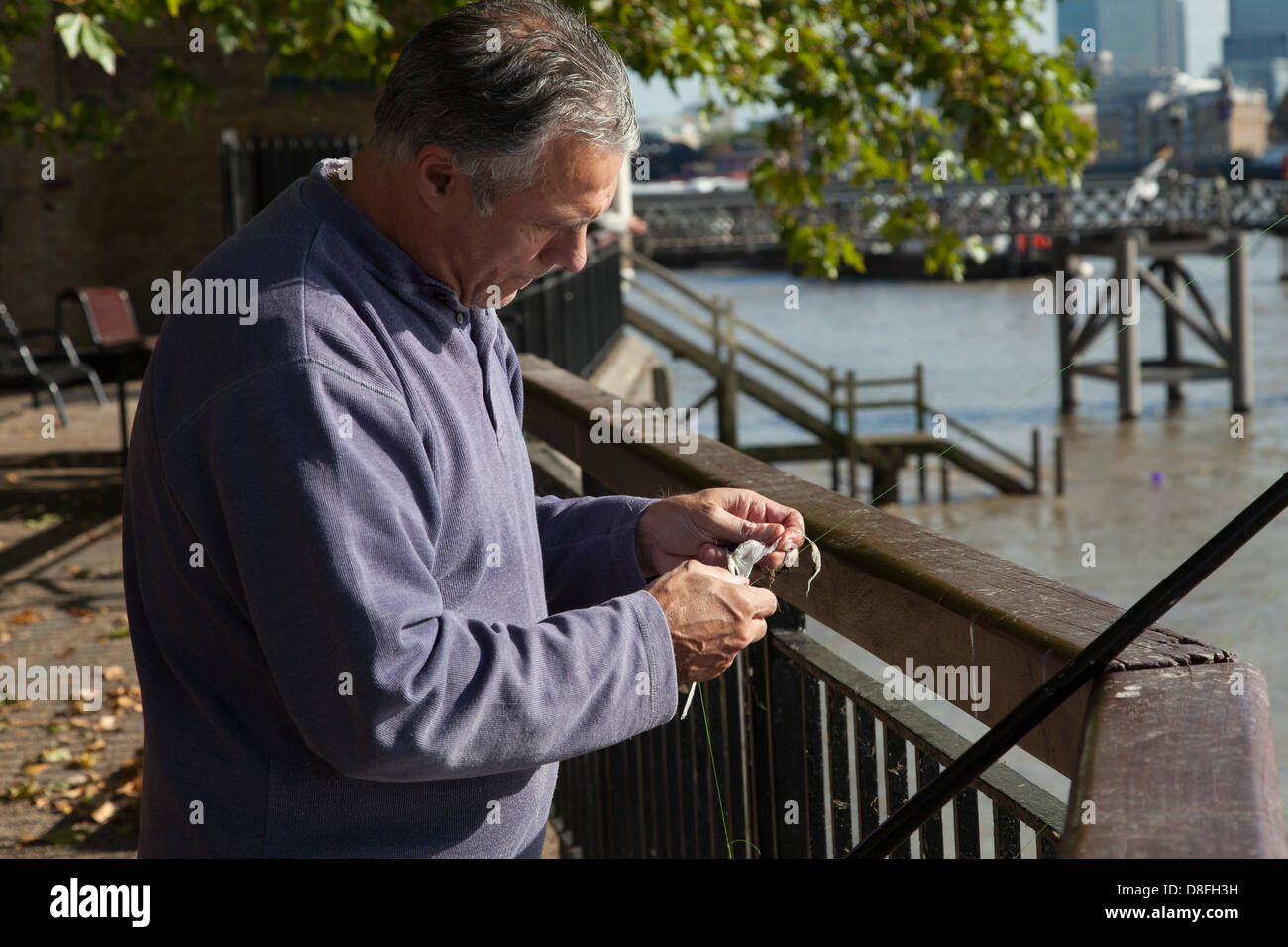Man eel fishing in River Thames, London Stock Photo - Alamy