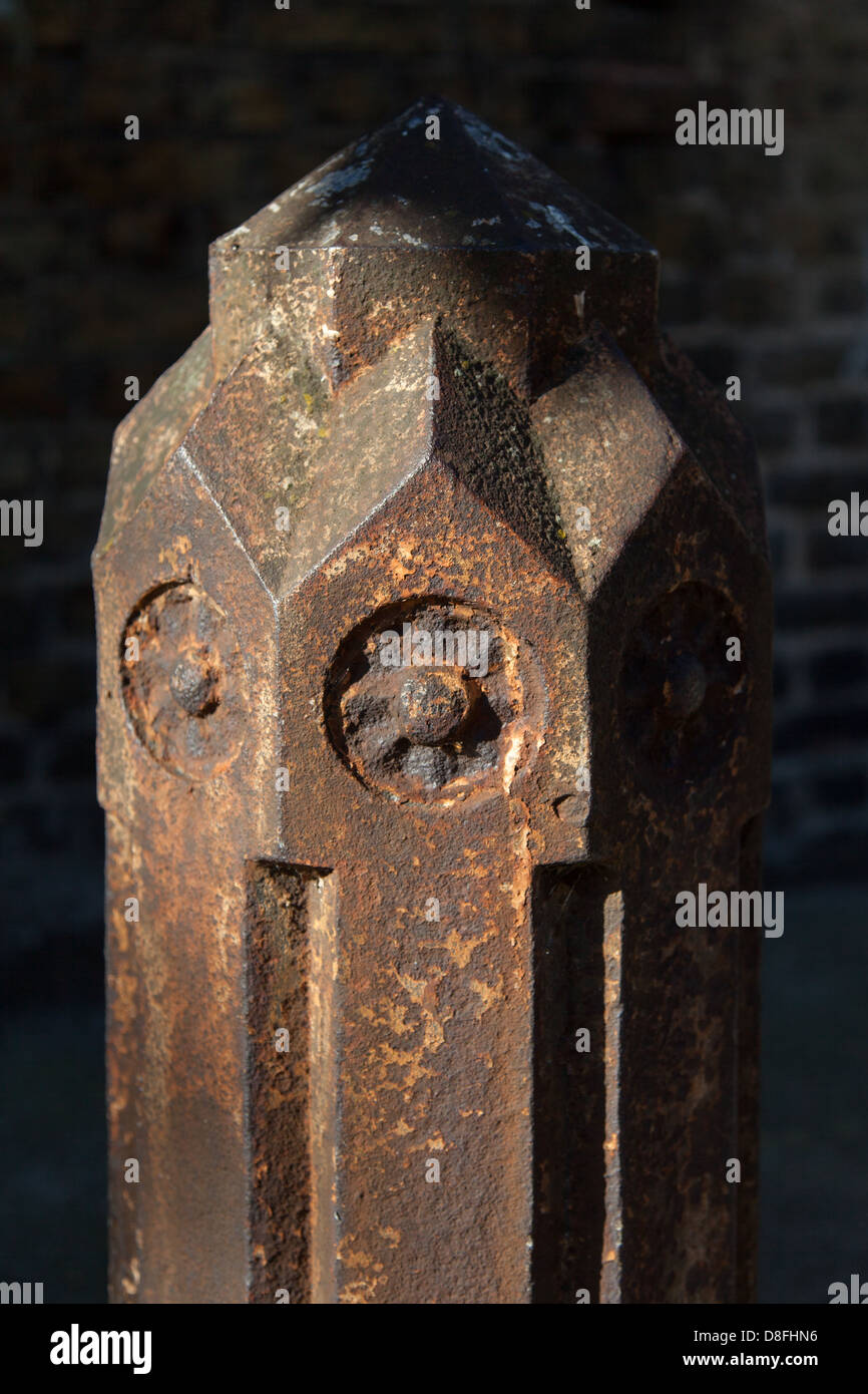 Sunlight on rusting street bollard in East London Stock Photo - Alamy