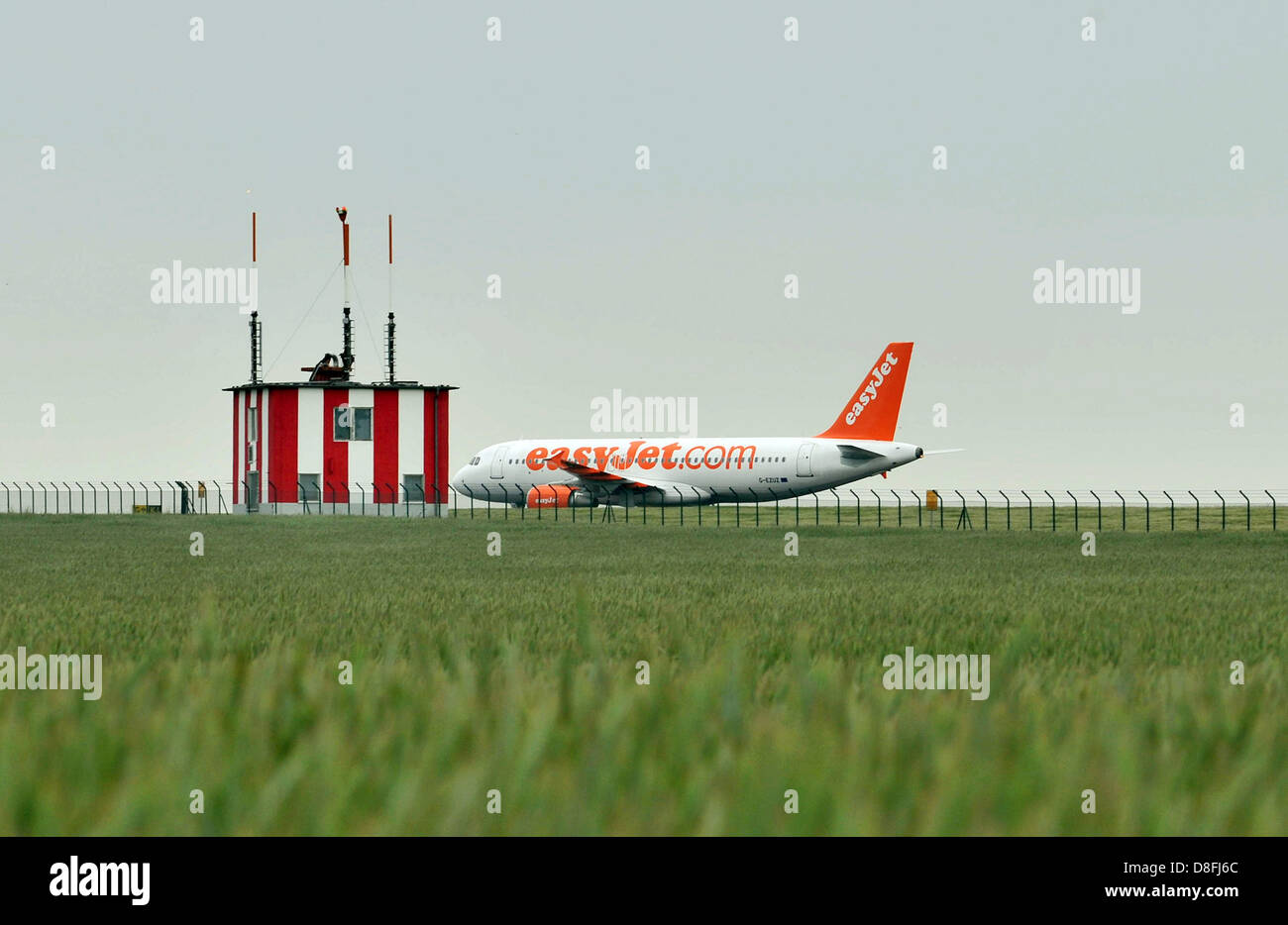 An easyjet airlines jet takes off past the terminal of the Berlin ...