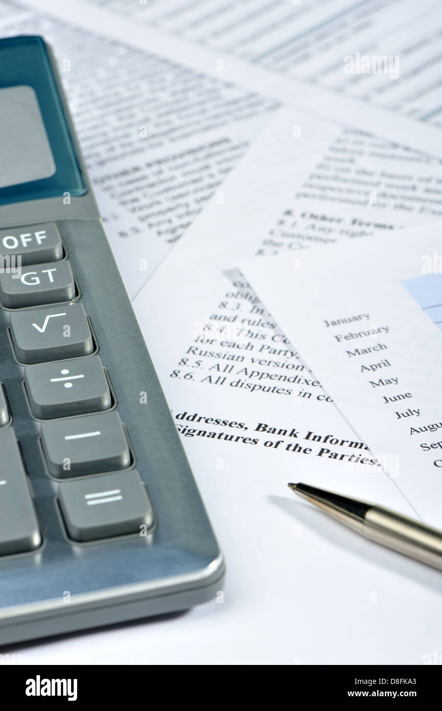 The calculator and the financial report Stock Photo - Alamy
