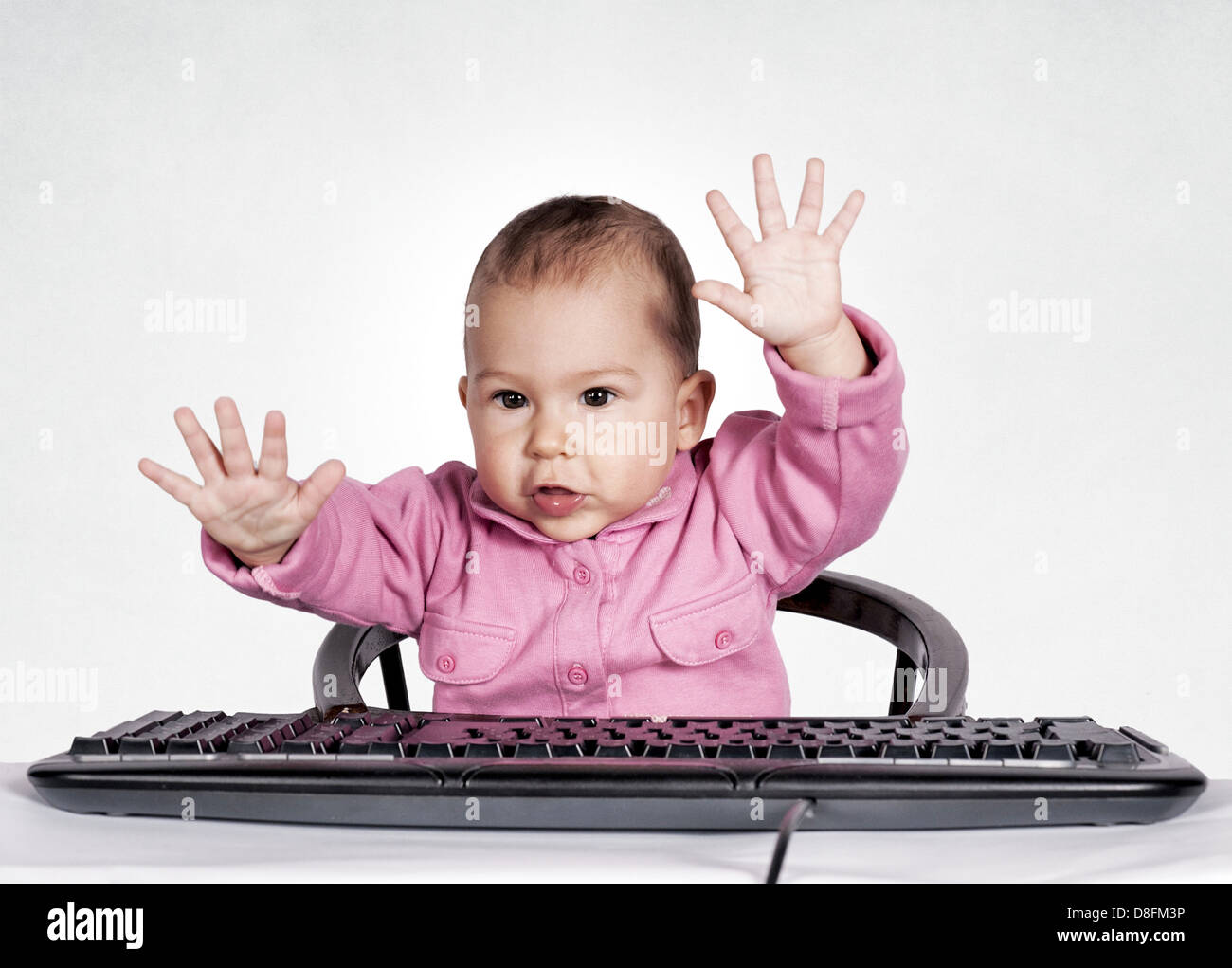 Happy baby on the keyboard Stock Photo - Alamy