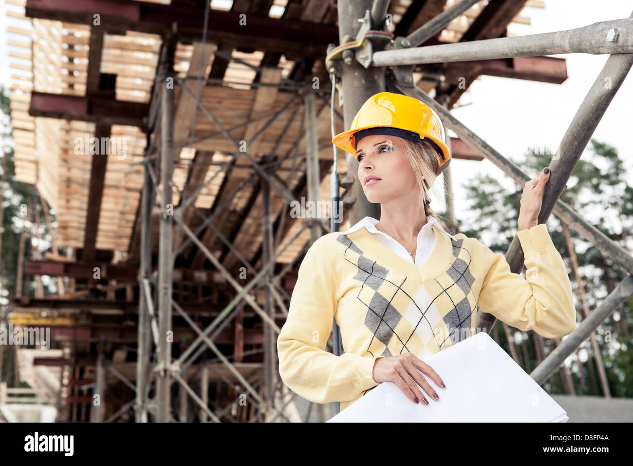 A young female constructor at building of a new motorway in Germany ...
