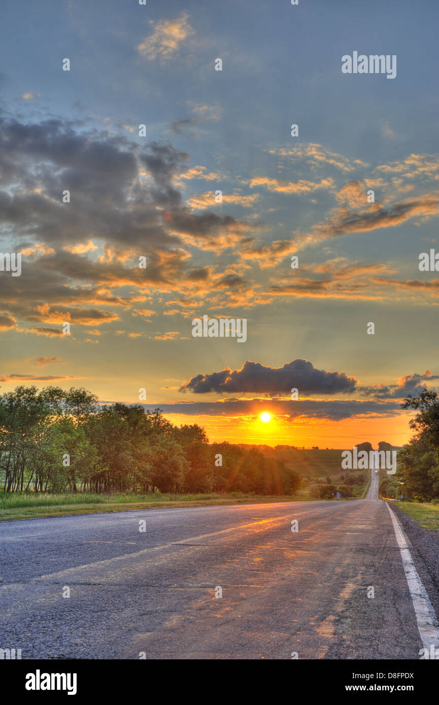 Road and sunset Stock Photo - Alamy