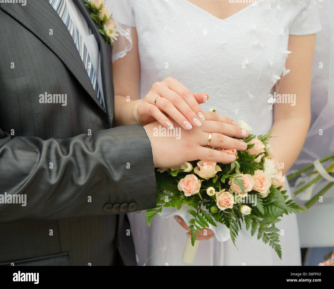 Hands of a newly-married couple Stock Photo - Alamy