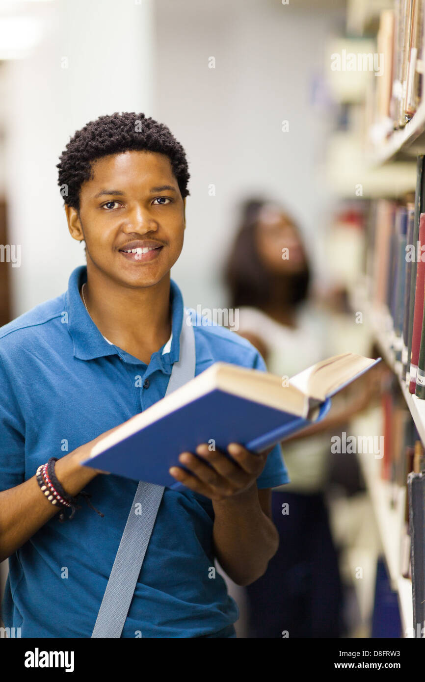 Boy reading in library hi-res stock photography and images - Alamy