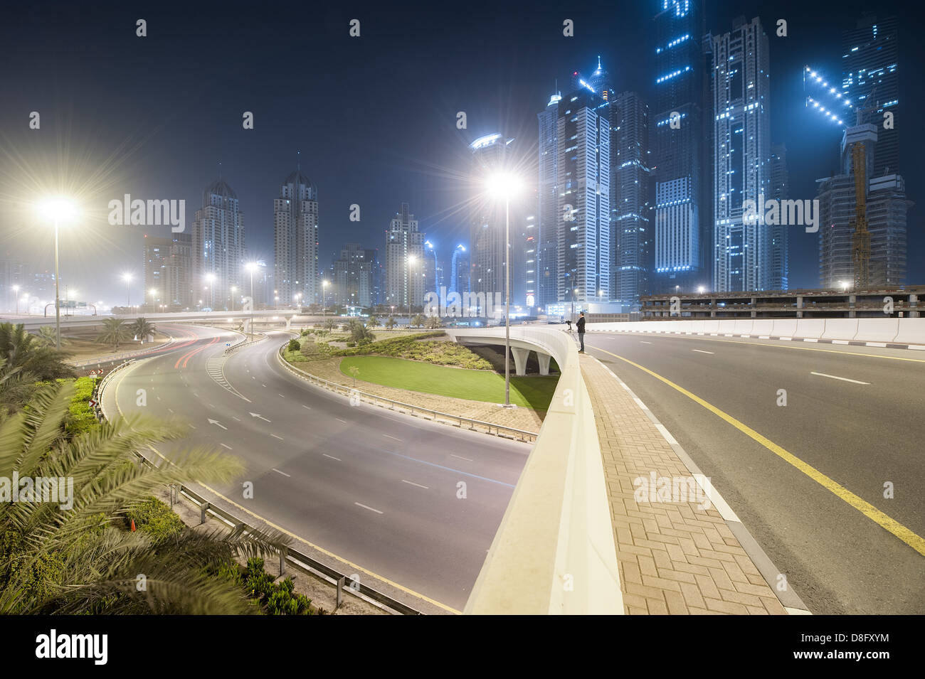 Interchange on Sheikh Zayed Road, skyscrapers and nocturnal haze in ...