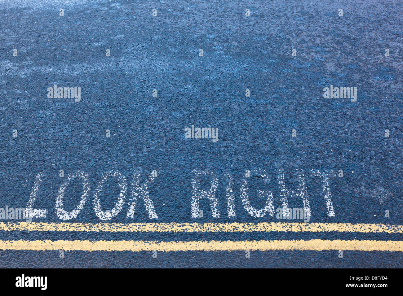Look right and double yellow line markings on a road Stock Photo - Alamy