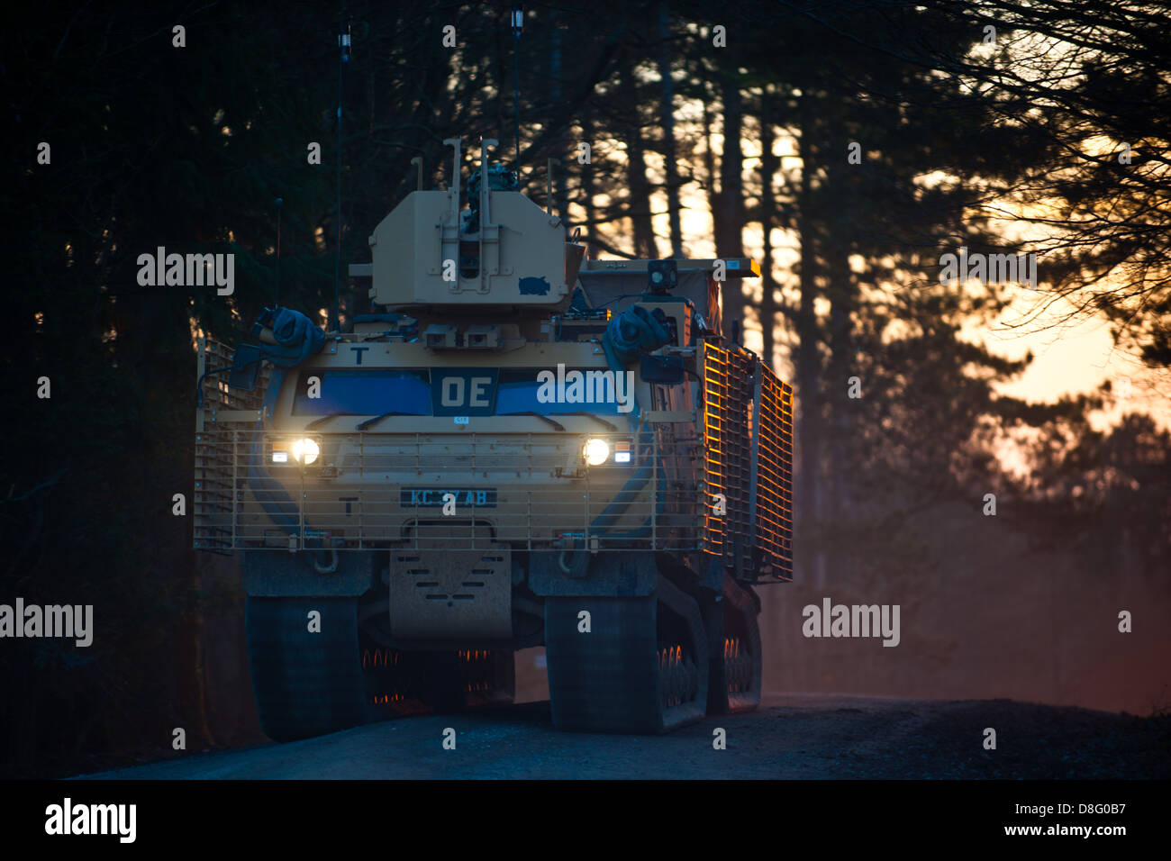 British Army Warthog protected patrol vehicle rumbles a long a dirt ...