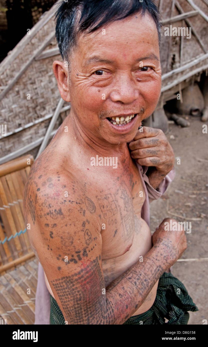 Elderly man with tattoos at Kyauktaing village on Lake Inle, Shan State ...