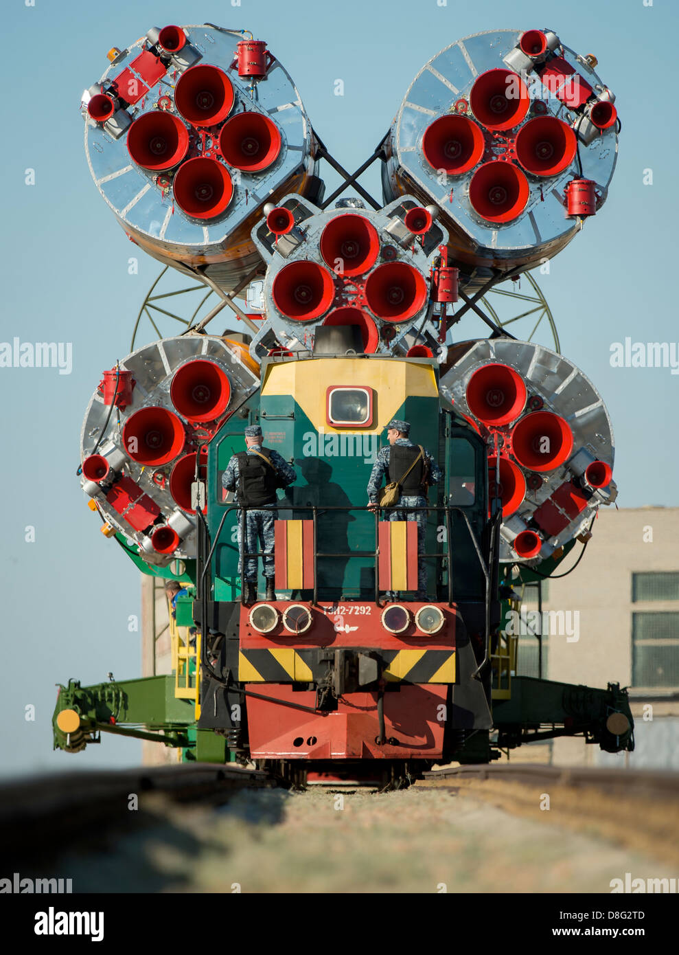 The Soyuz TMA-09M spacecraft is rolled out by train to the Baikonur ...