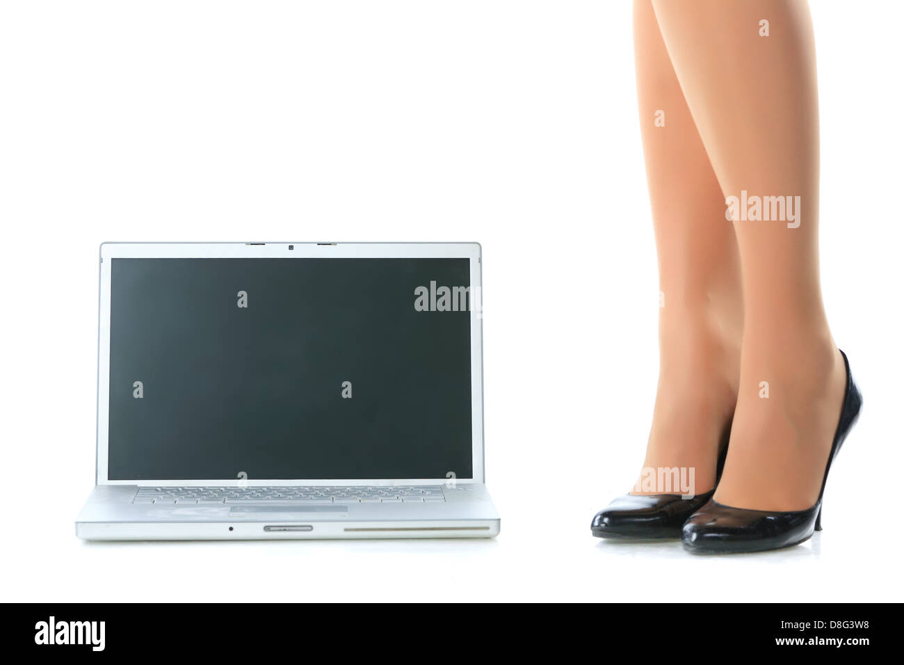Women's legs and the laptop Stock Photo - Alamy