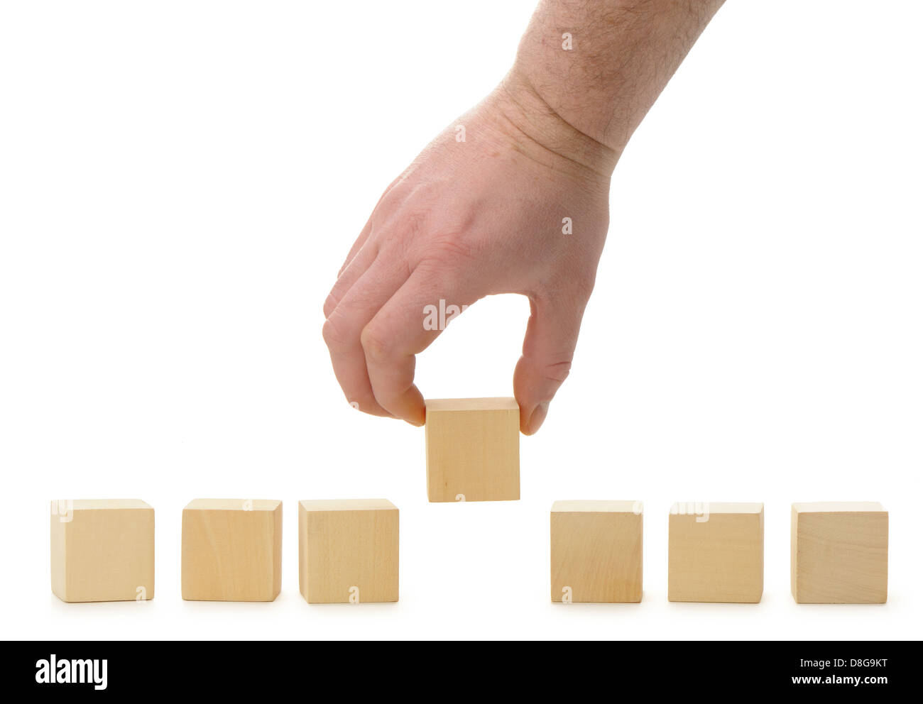 Hand holding white cube Cut Out Stock Images & Pictures - Alamy