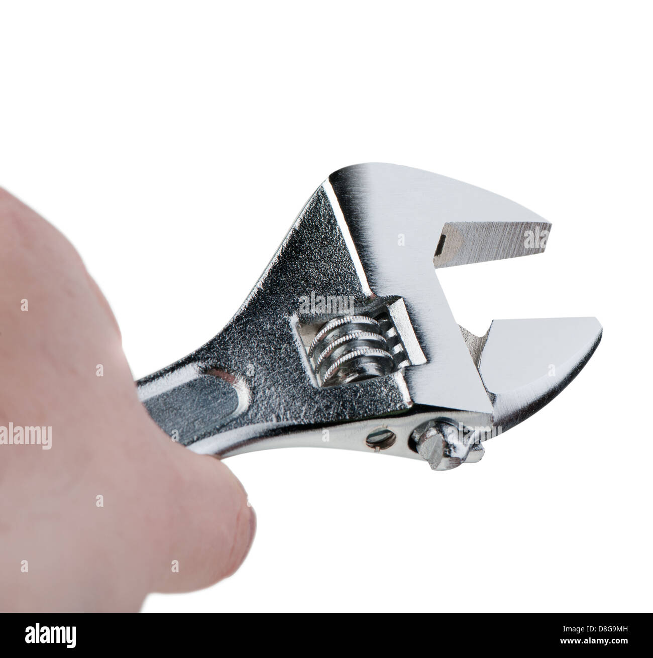 Adjustable spanner in hand Stock Photo - Alamy