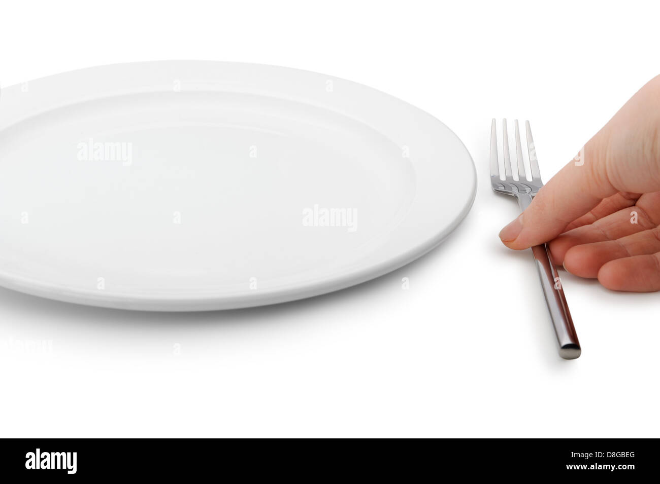The hand puts fork to a plate Stock Photo - Alamy
