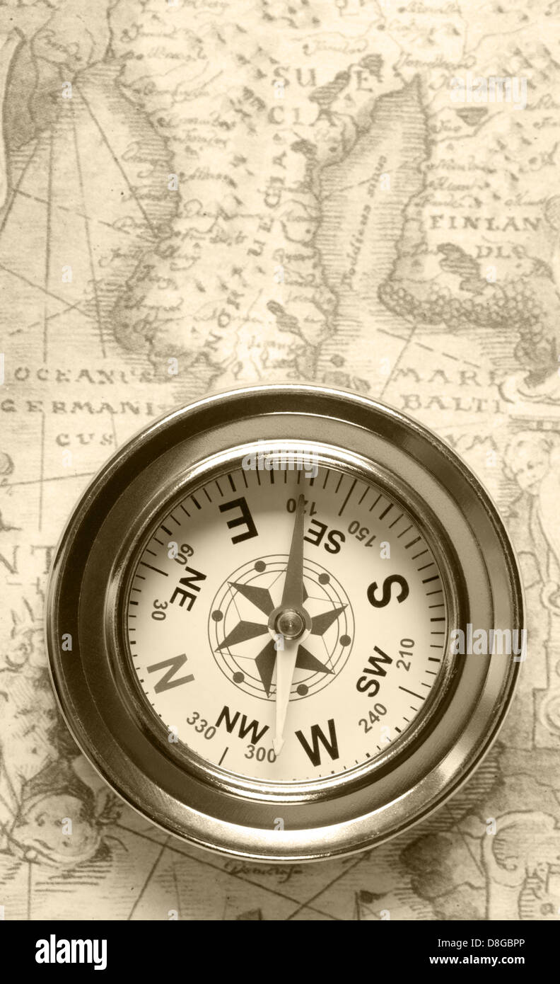 Old compass on ancient map Stock Photo - Alamy
