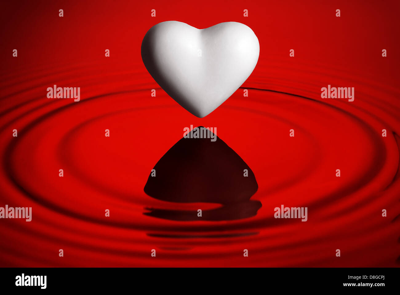 White heart over water ripples Stock Photo - Alamy