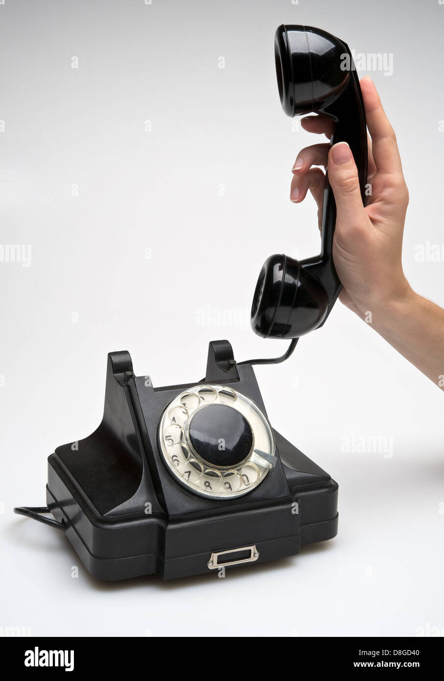 Vintage telephone being picked up Stock Photo - Alamy