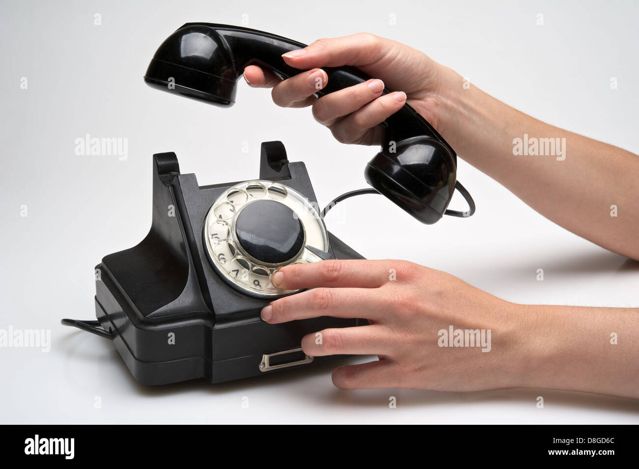 Vintage telephone being picked up Stock Photo - Alamy