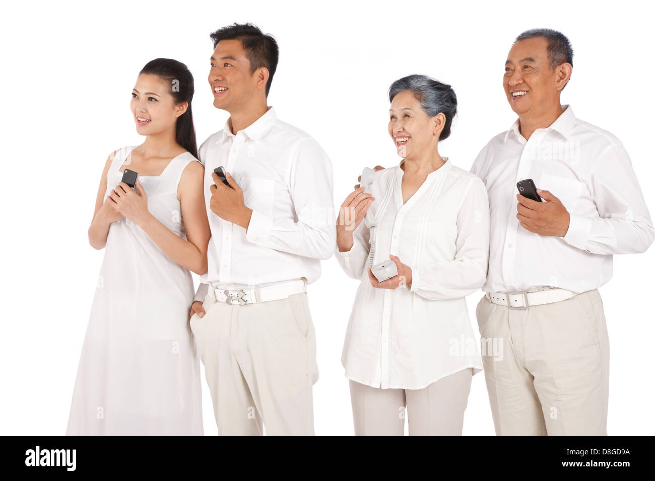 Young couple and old couple making phone call Stock Photo - Alamy