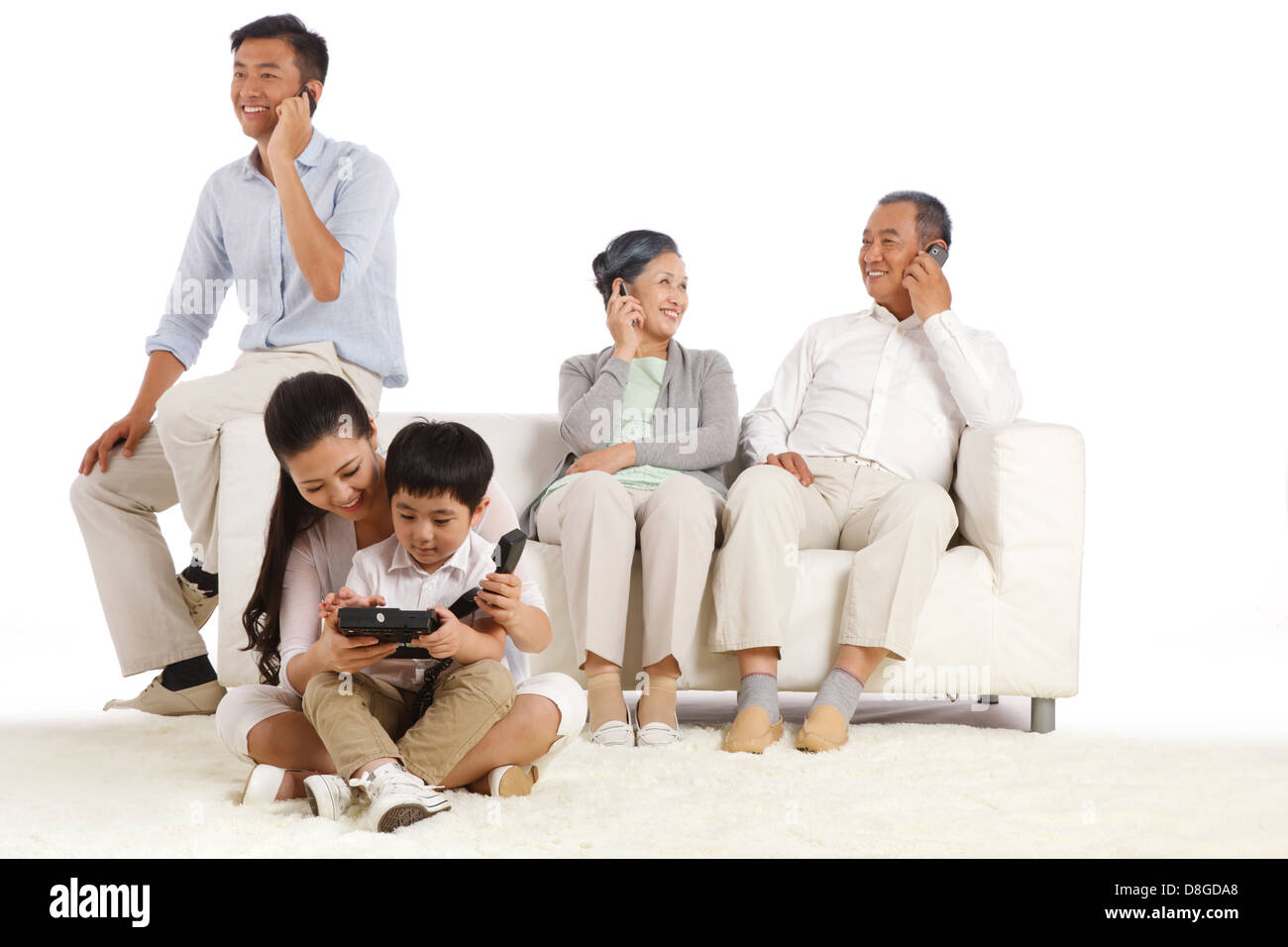 Whole family making phone call Stock Photo - Alamy