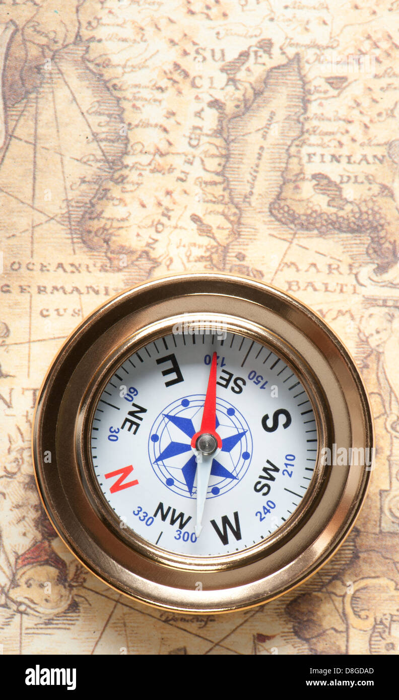Old compass on ancient map Stock Photo - Alamy