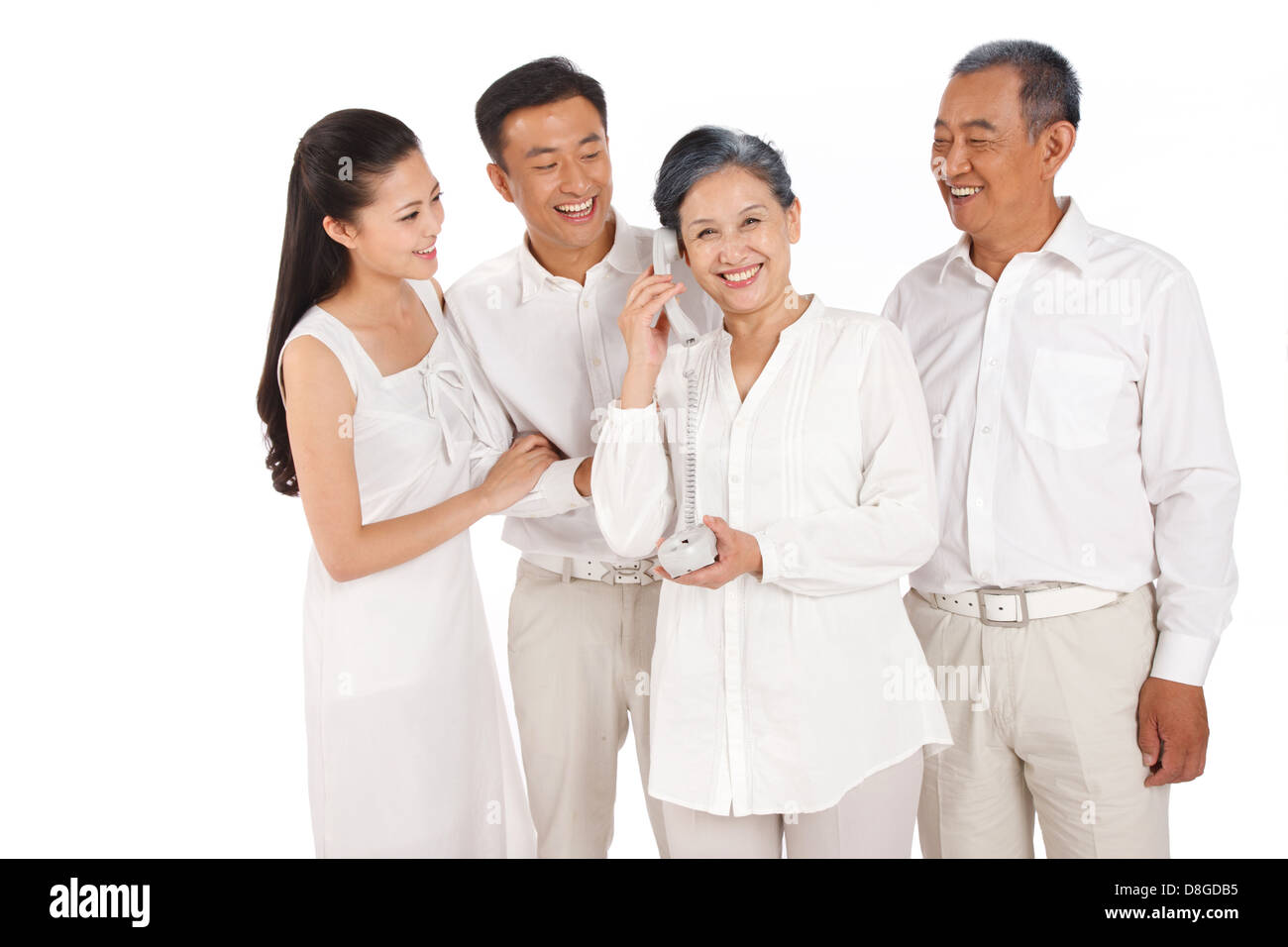 Young couple and old couple making phone call Stock Photo - Alamy