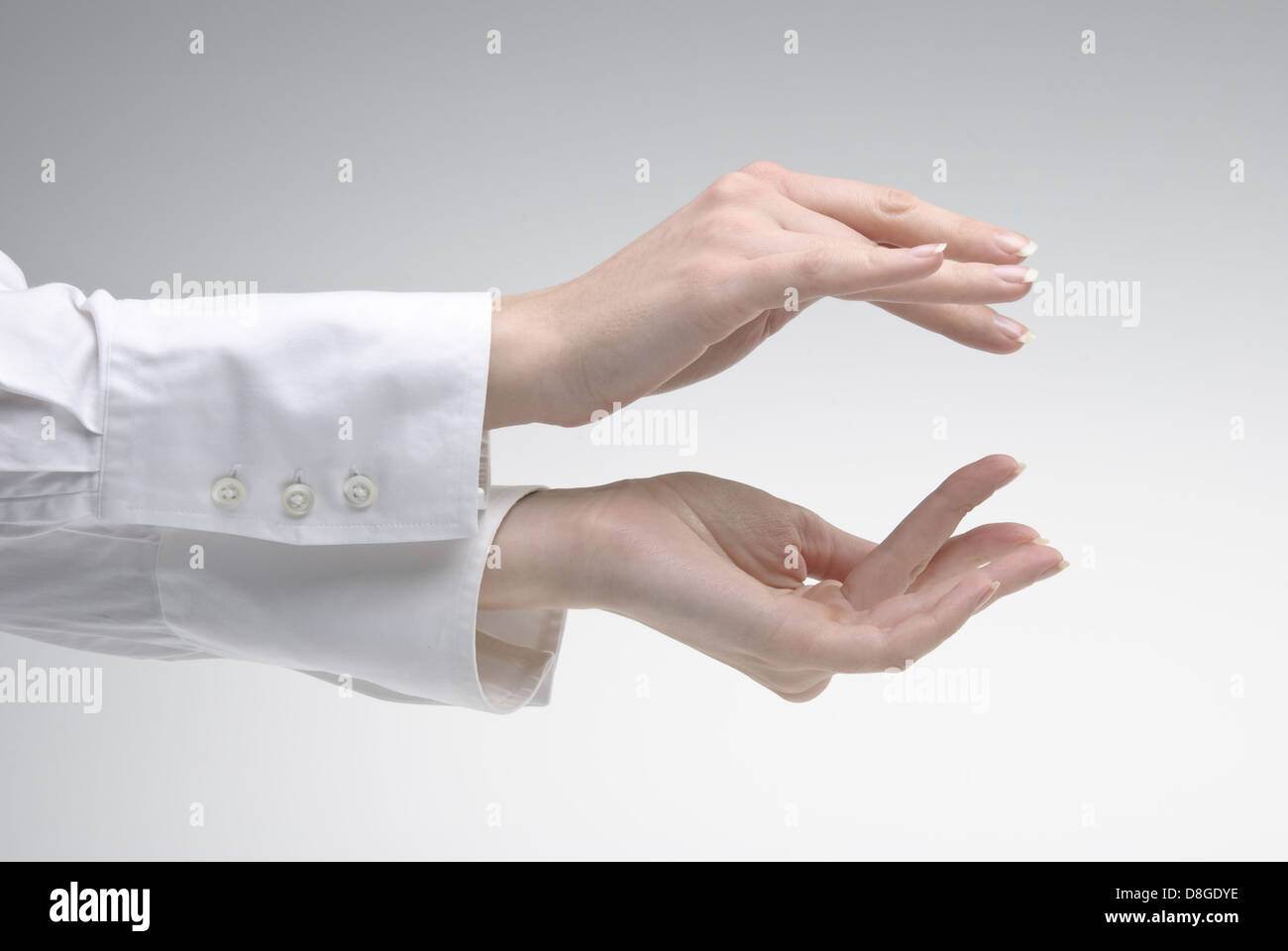 Hand symbol for small hi-res stock photography and images - Alamy