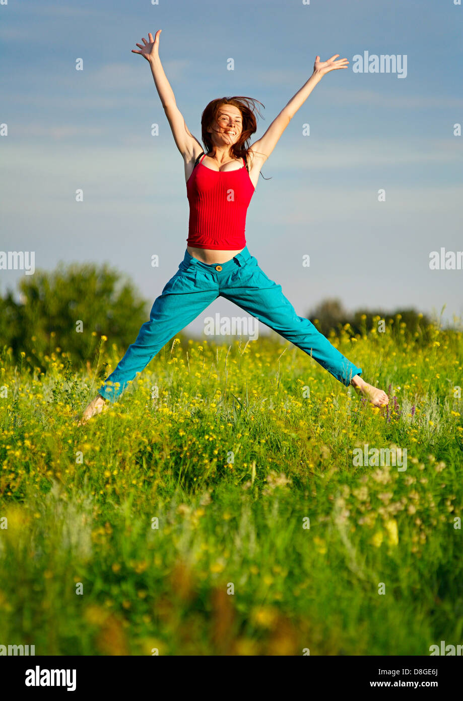 Woman jumping on a sunset Stock Photo - Alamy