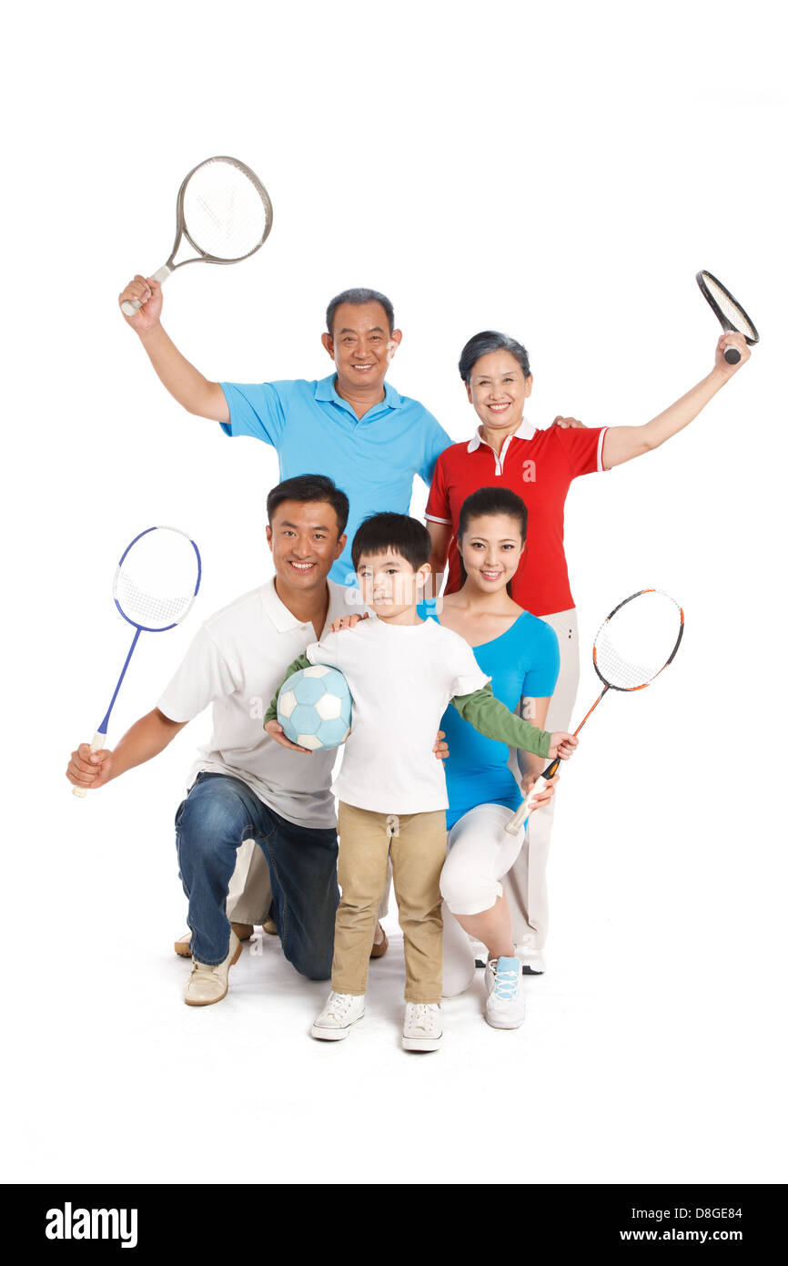 Whole family holding racket Stock Photo - Alamy