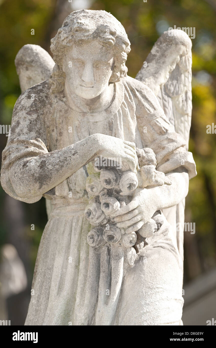 Monument to an angel on a cemetery Stock Photo - Alamy
