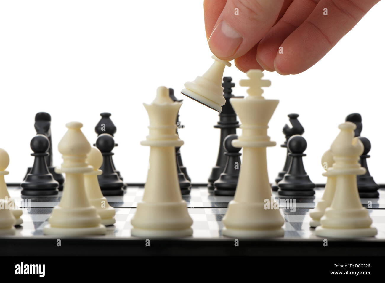 Pawn in hands over a chessboard Stock Photo - Alamy